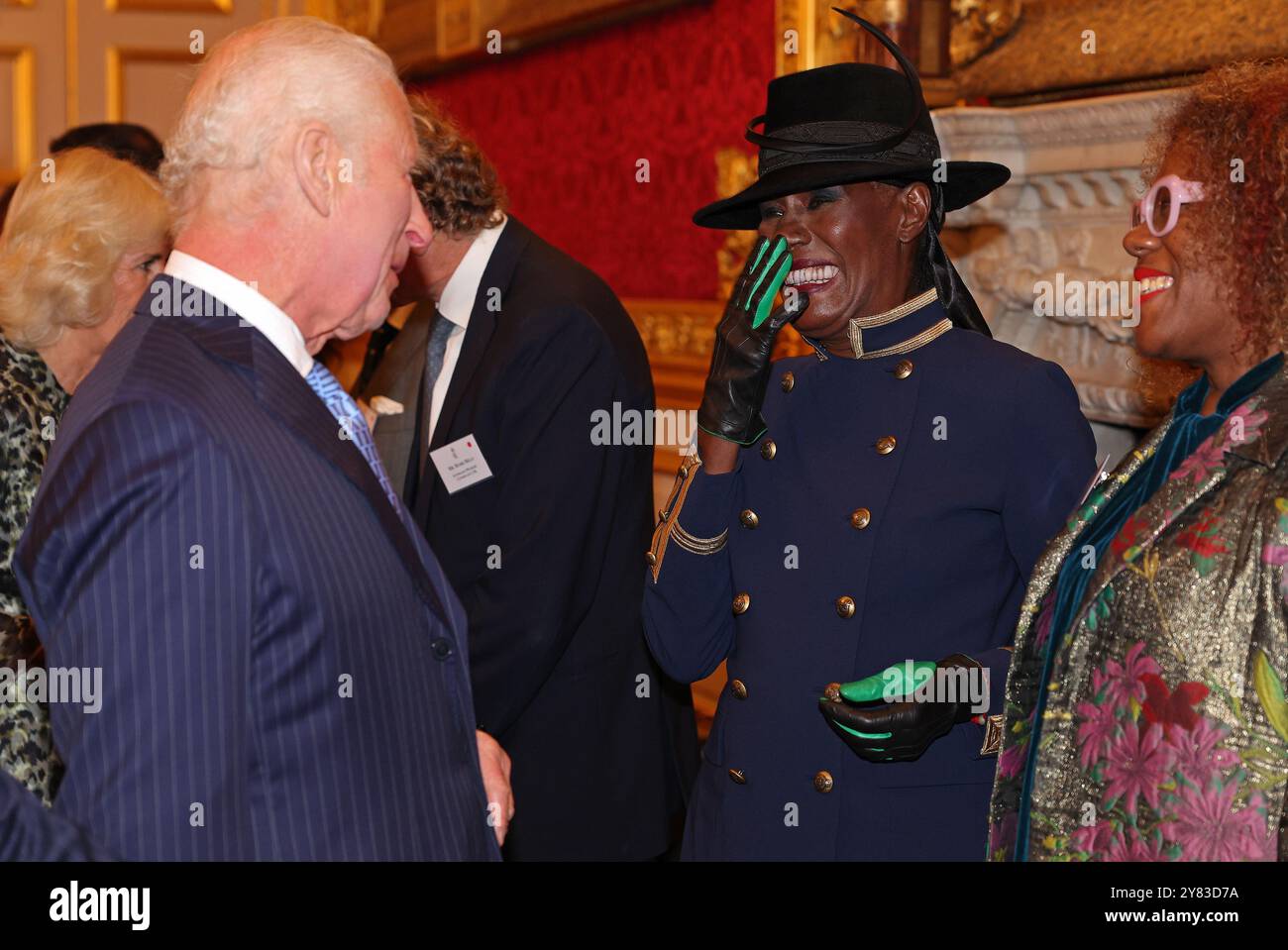 King Charles III speaks with Grace Jones during a reception at St ...