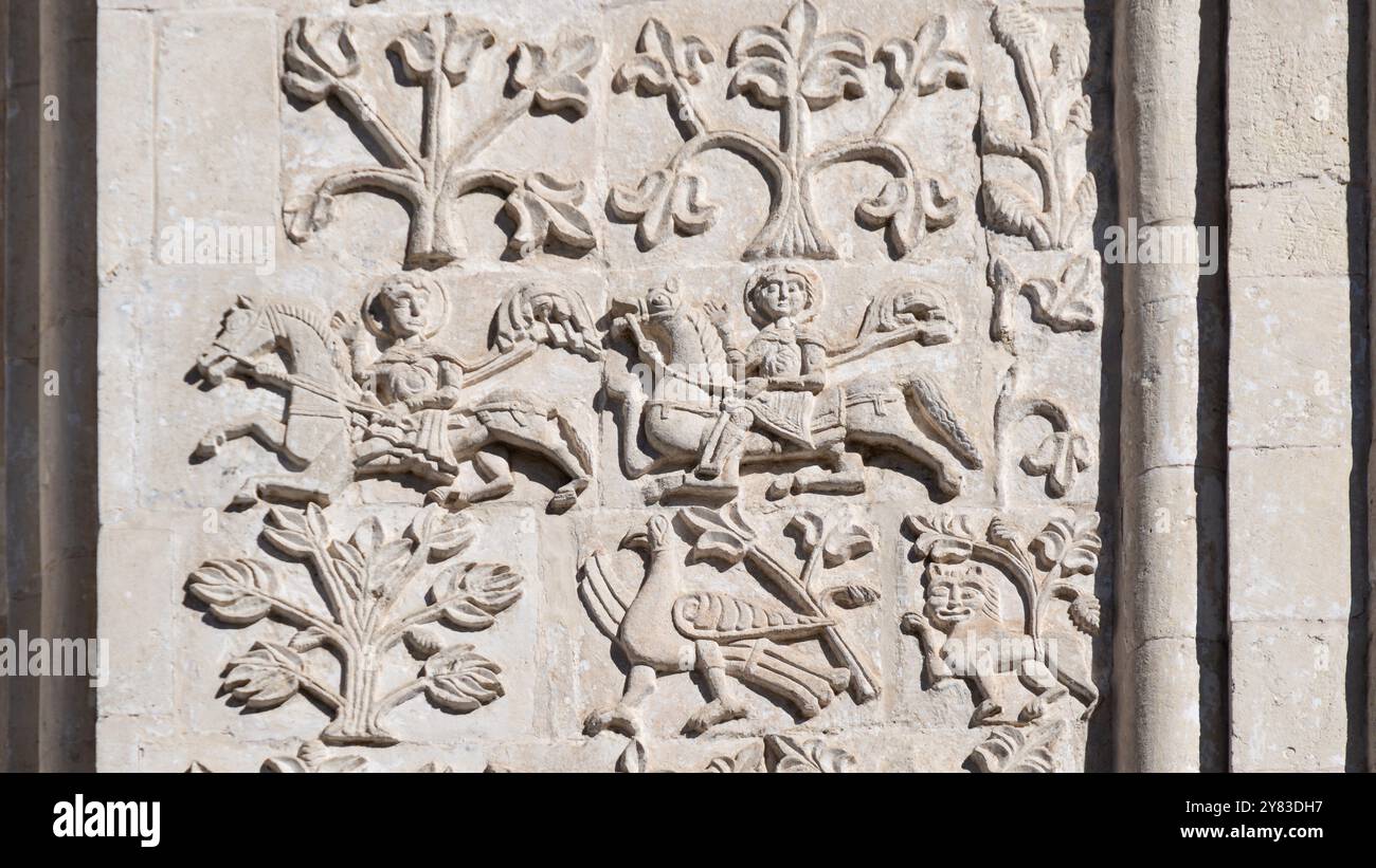 Medieval bas-relief sculptures, depicting horsemen surrounded by plants ...