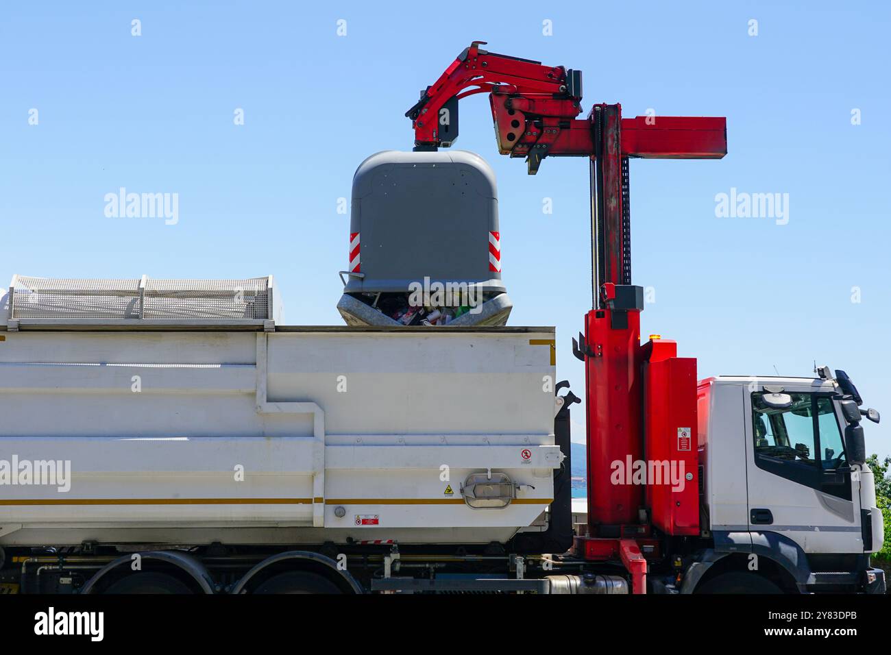 Modern semi-automatic emptying dustbin into waste vehicle, garbage ...