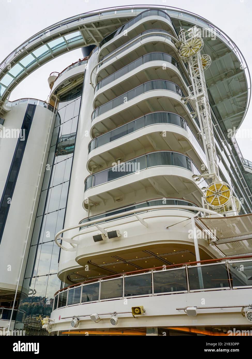 High stern of a large cruise ship with balconies on a sky background ...