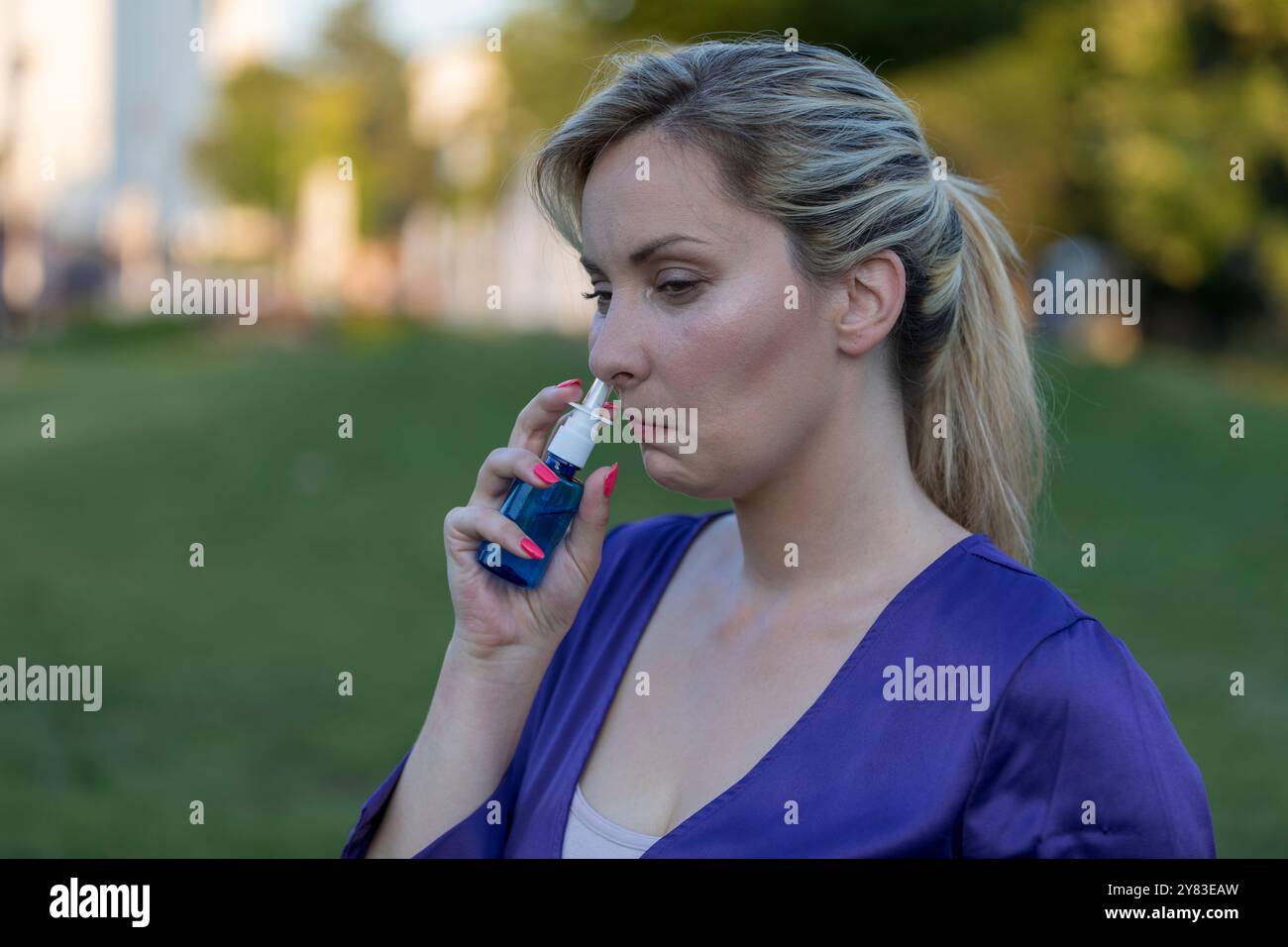 An asthmatic woman who takes an inhaler and has an asthma attack. She ...
