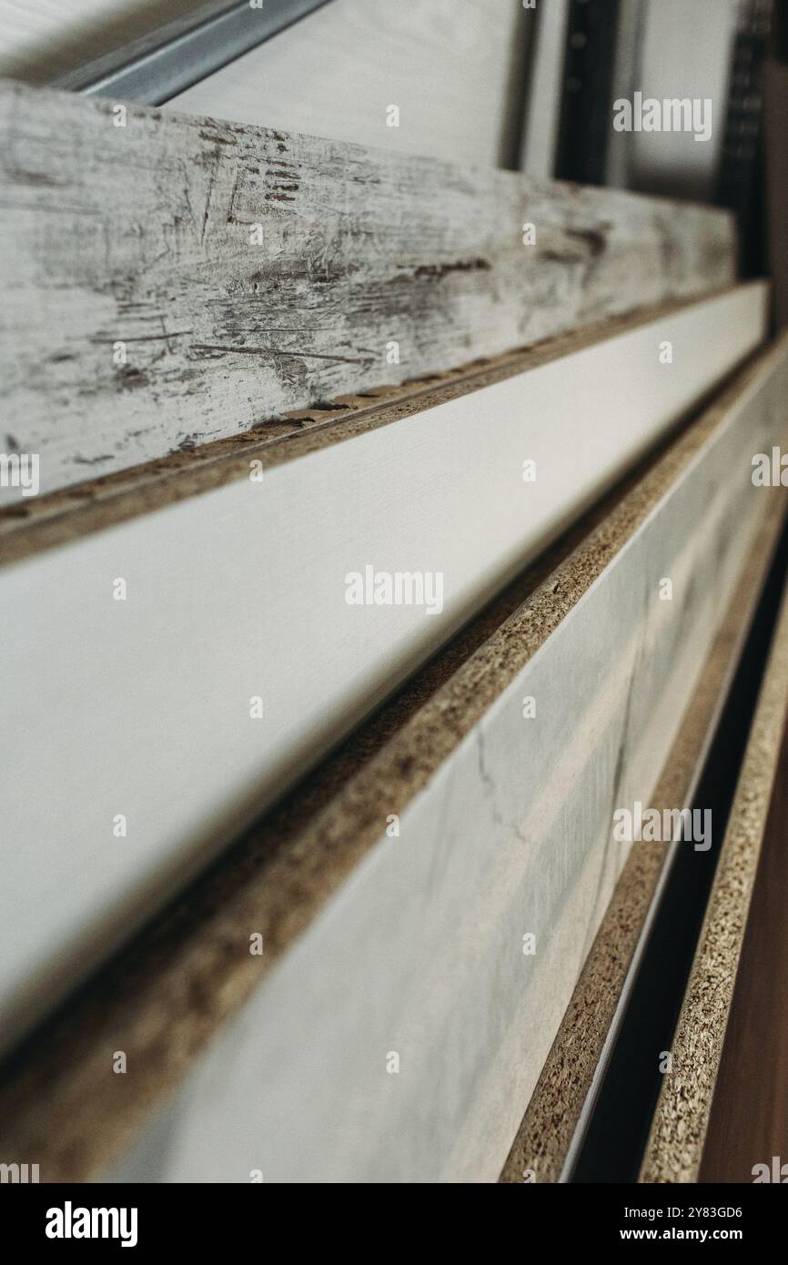 Close-up of a stack of plywood panels with different finishes ...