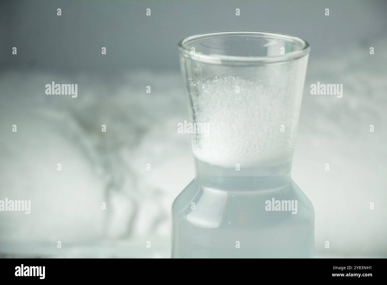 gin and tonic white foam alcoholic cocktail, snow ice background inside ...