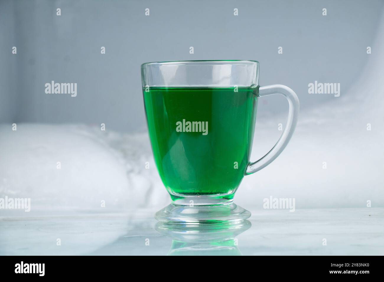 Green cocktail drink in glass cup, single green cocktail, ice cooler ...