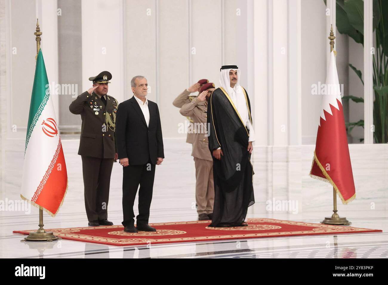 Qatar, Doha. 2nd Oct, 2024. Iranian President MASOUD PEZESHKIAN (L) and ...