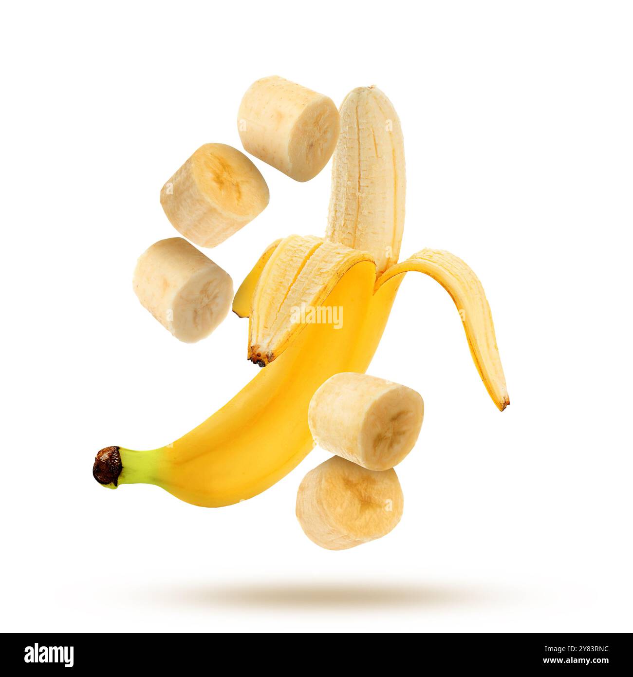 Fresh ripe bananas falling on white background Stock Photo - Alamy