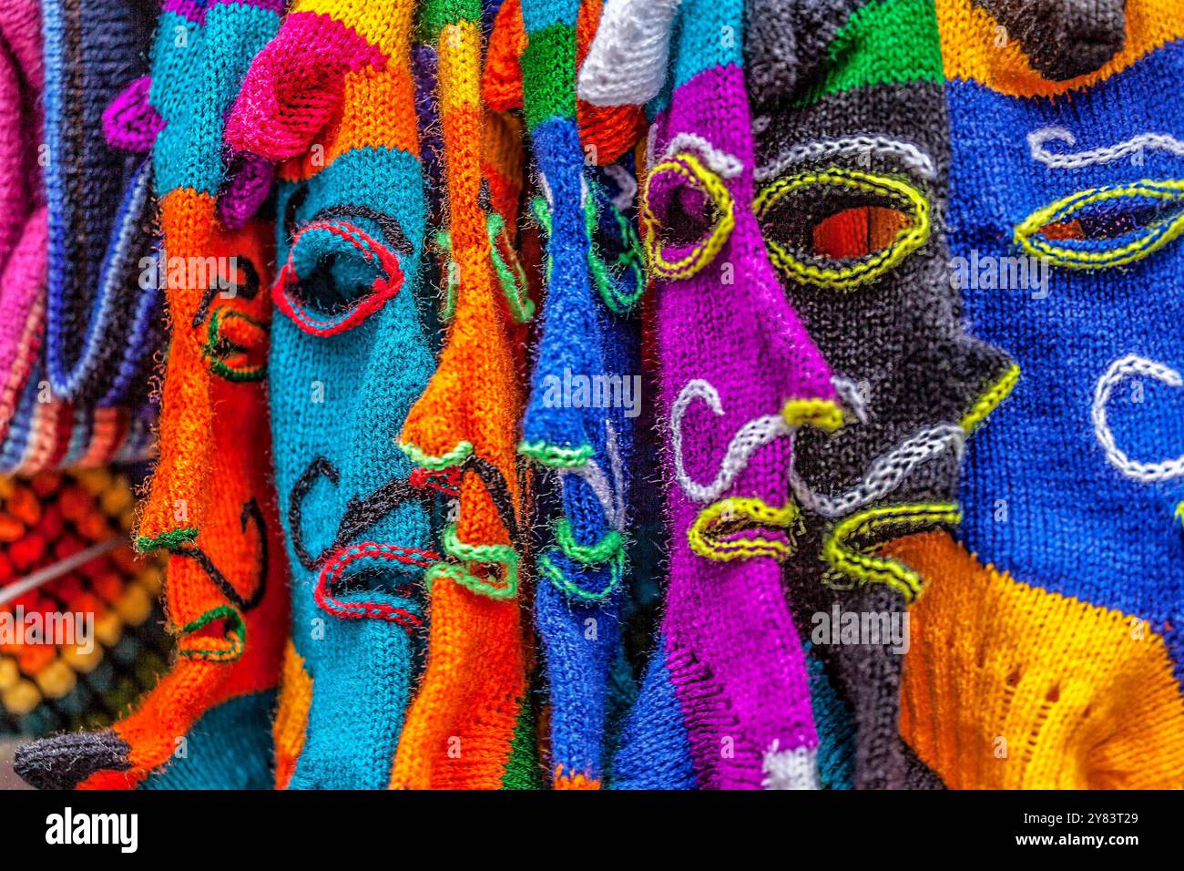 Colourful display of woven merchandise with faces, the Witches' Market ...