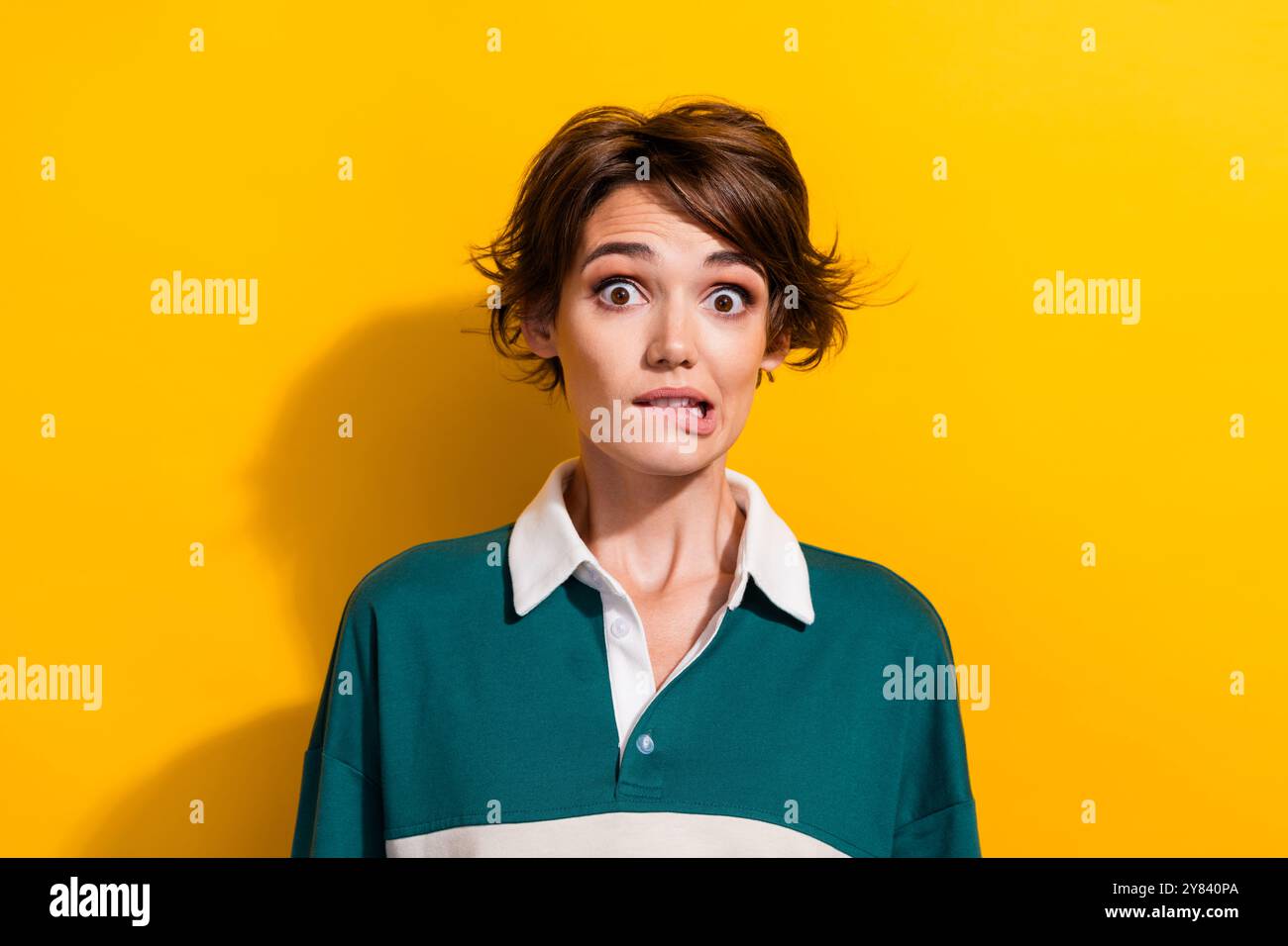 Photo of scared unsure woman wear polo shirt biting lip having problems ...