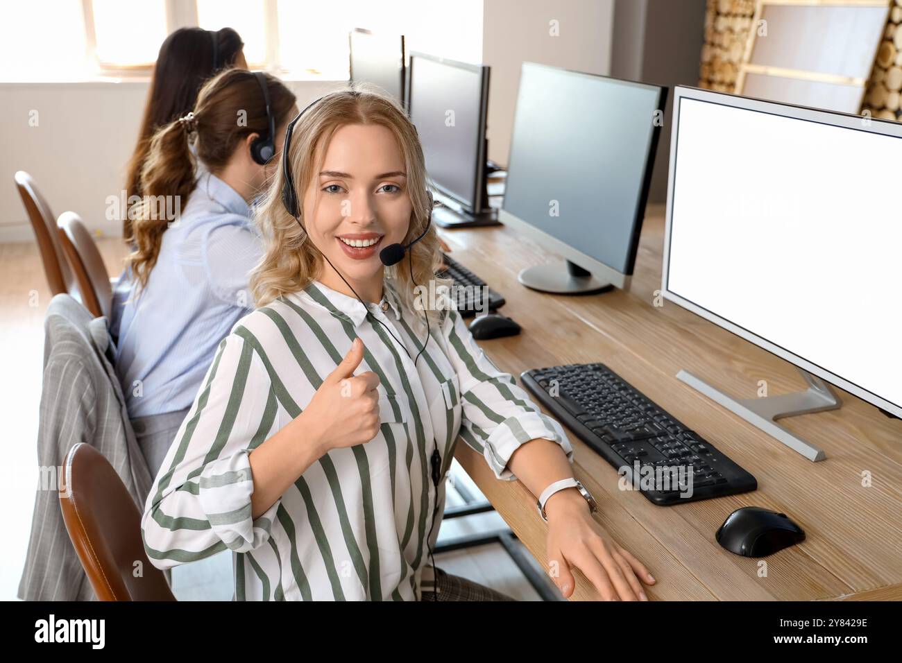 Female technical support agents working in office Stock Photo - Alamy