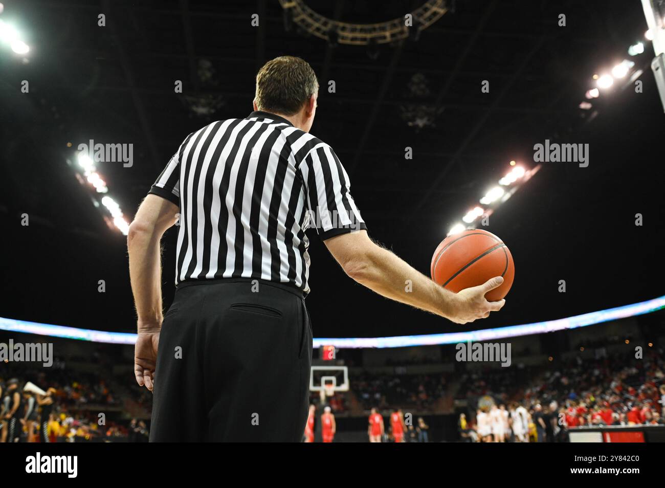Basketball Referee Holding a Ball in a Sports Arena Before Putting the ...