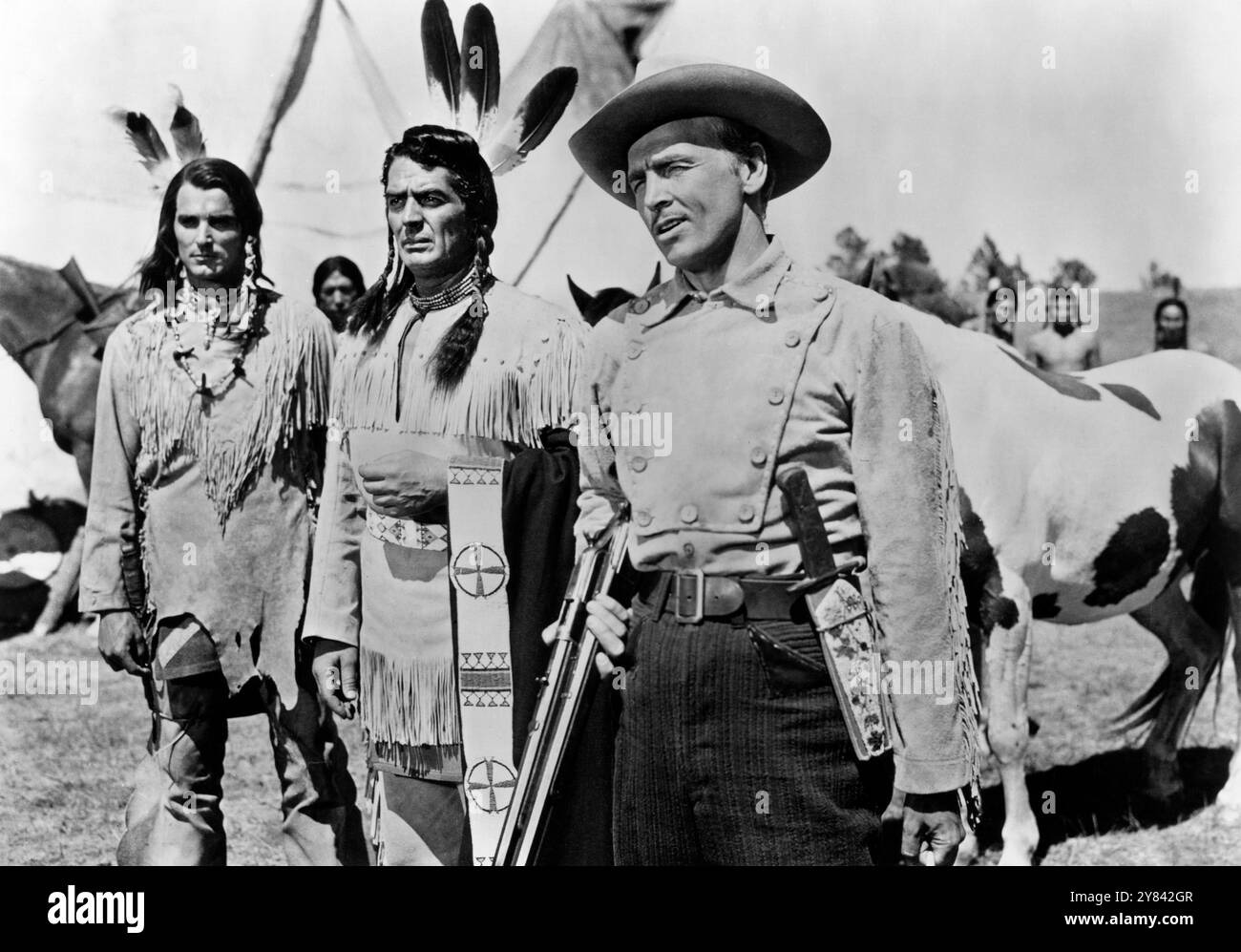 Keith Larson (left), Victor Mature (center), James Millican (right), on ...