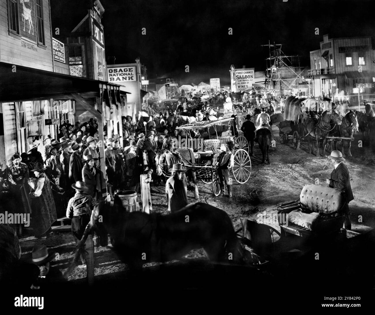 Crowd and street scene at night, on-set of the western film, "Cimarron ...