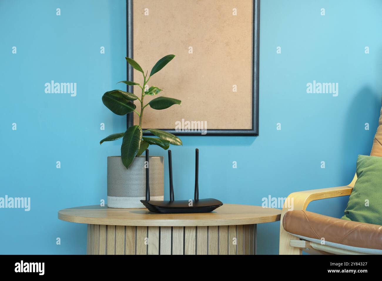 Modern wi-fi router with plant on table in living room at night Stock ...