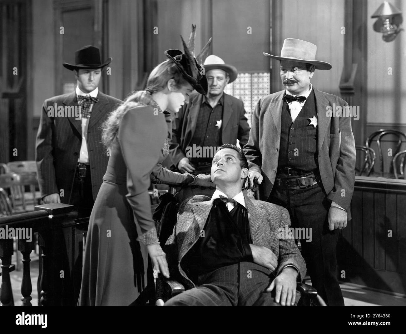Martha O'Driscoll, Jess Barker (seated), on-set of the western film ...