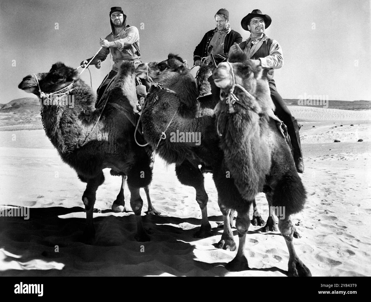 Anthony Caruso, George Tobias, John Doucette, on-set of the western ...