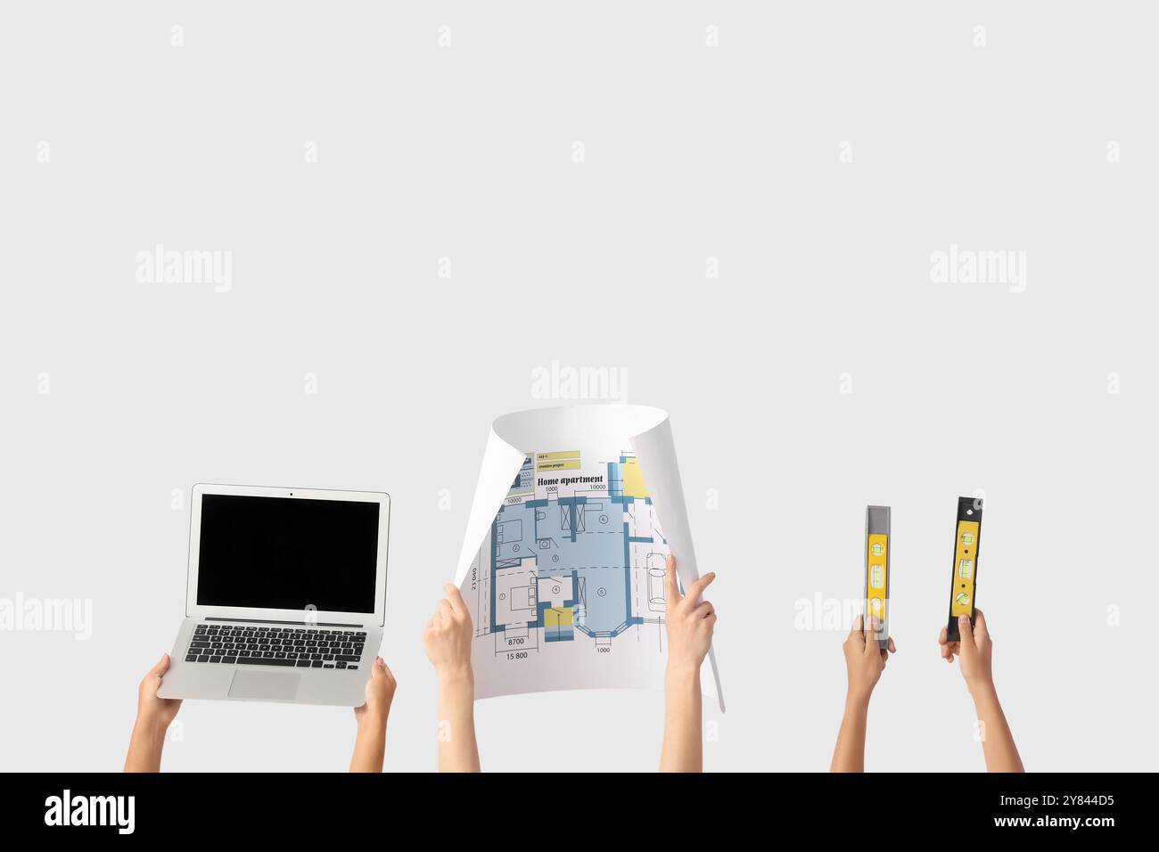 Architects with house plan, laptop and levels on light background Stock ...