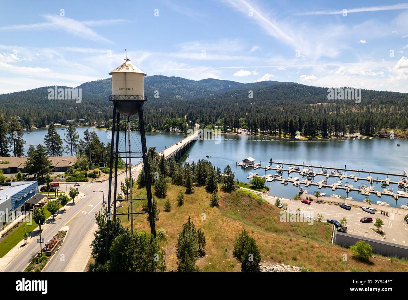 Scenic vista of Post Falls, Idaho, along the Spokane River, highlighting a charming water tower ...