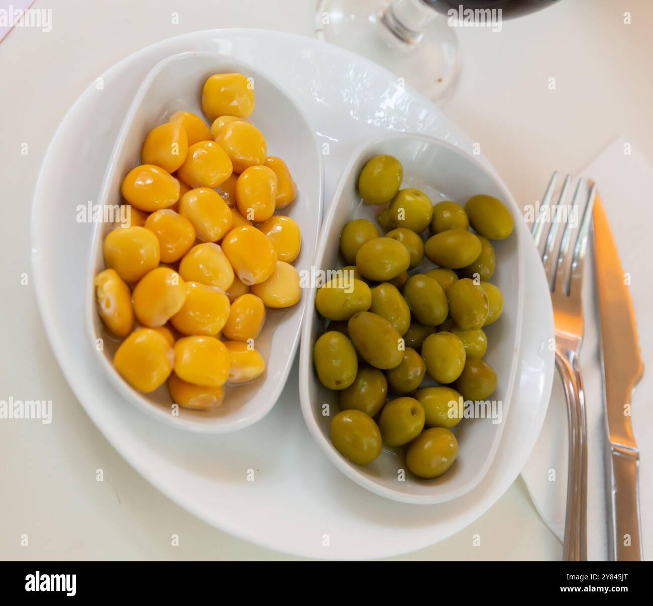 Delicious spanish tapas from olives and pickled beans Stock Photo - Alamy