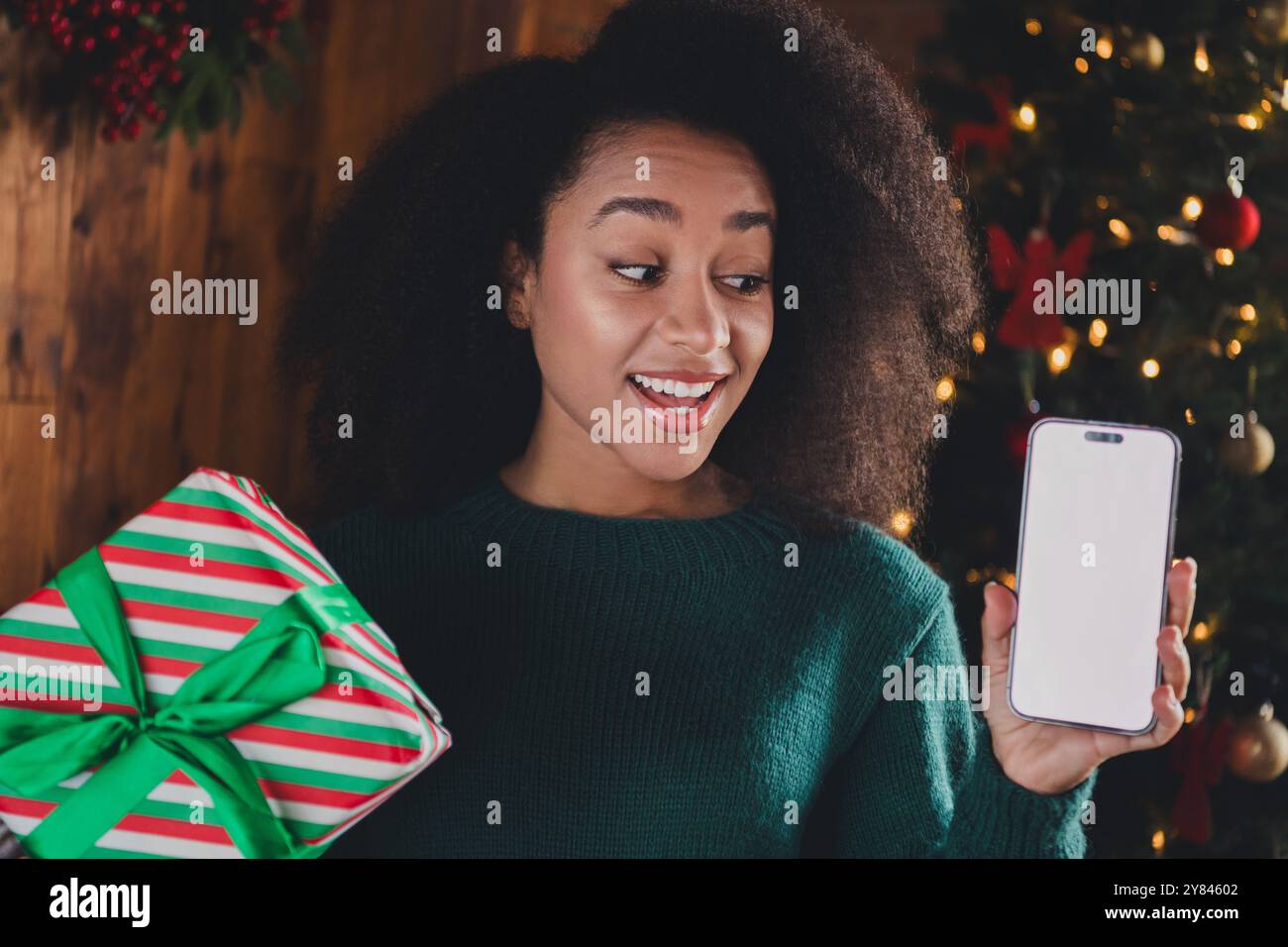 Photo of cute adorable girl showing display screen qr code website make ...