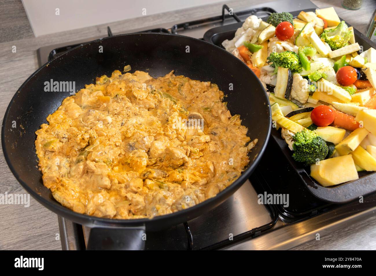 Top view kitchen counter stove top with a wok pan of homemade indian ...