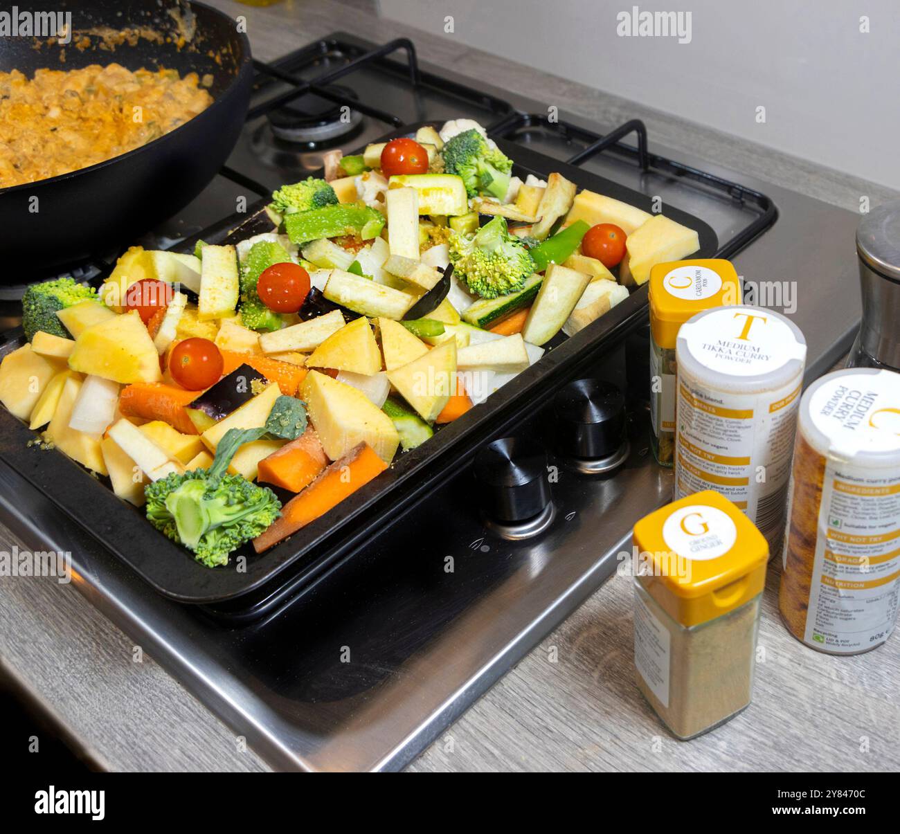 Top view kitchen counter stove top with a wok pan of homemade indian ...