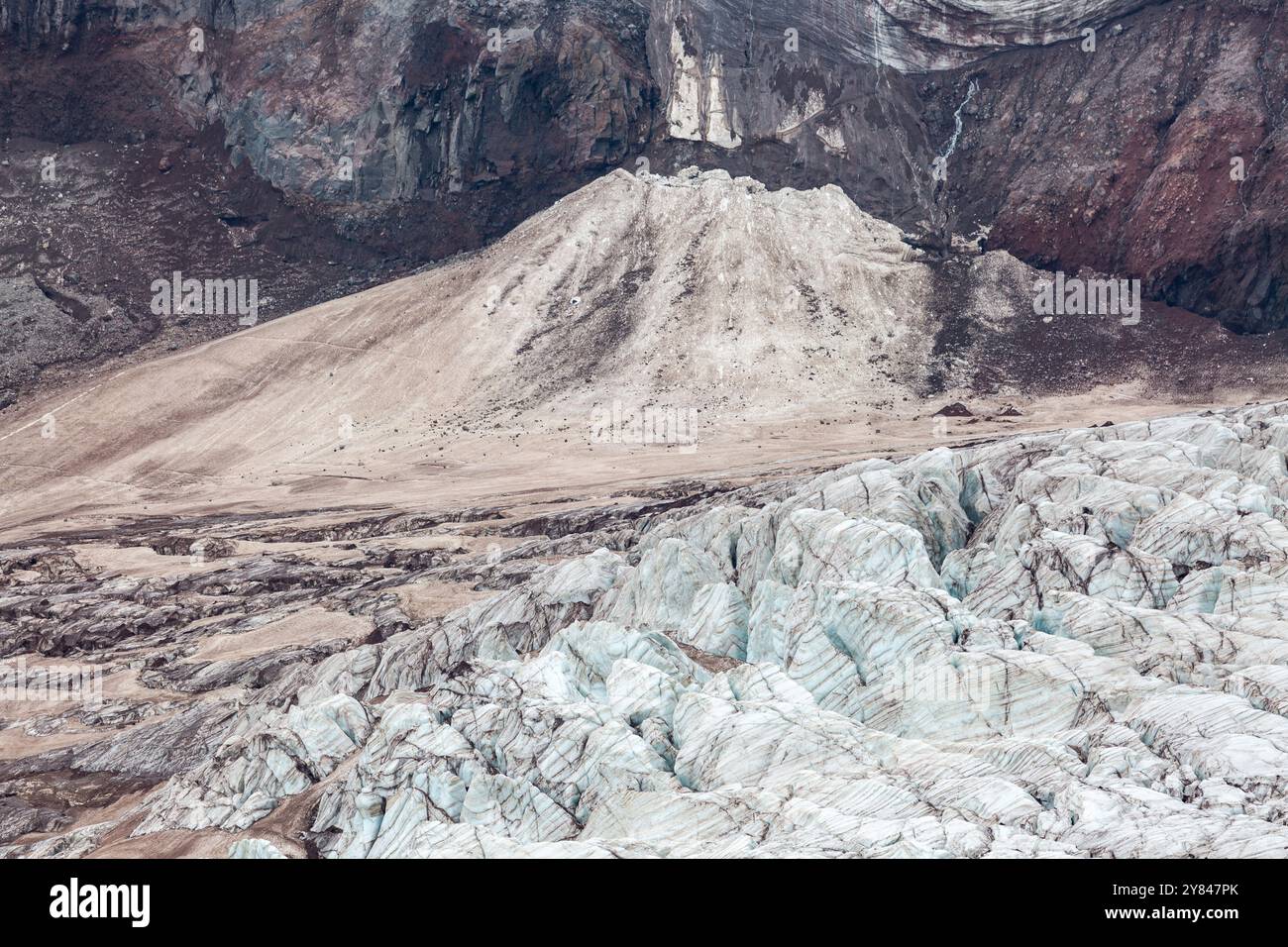 Glacial Fortress: The mountain peaks are shrouded in a veil of mist ...