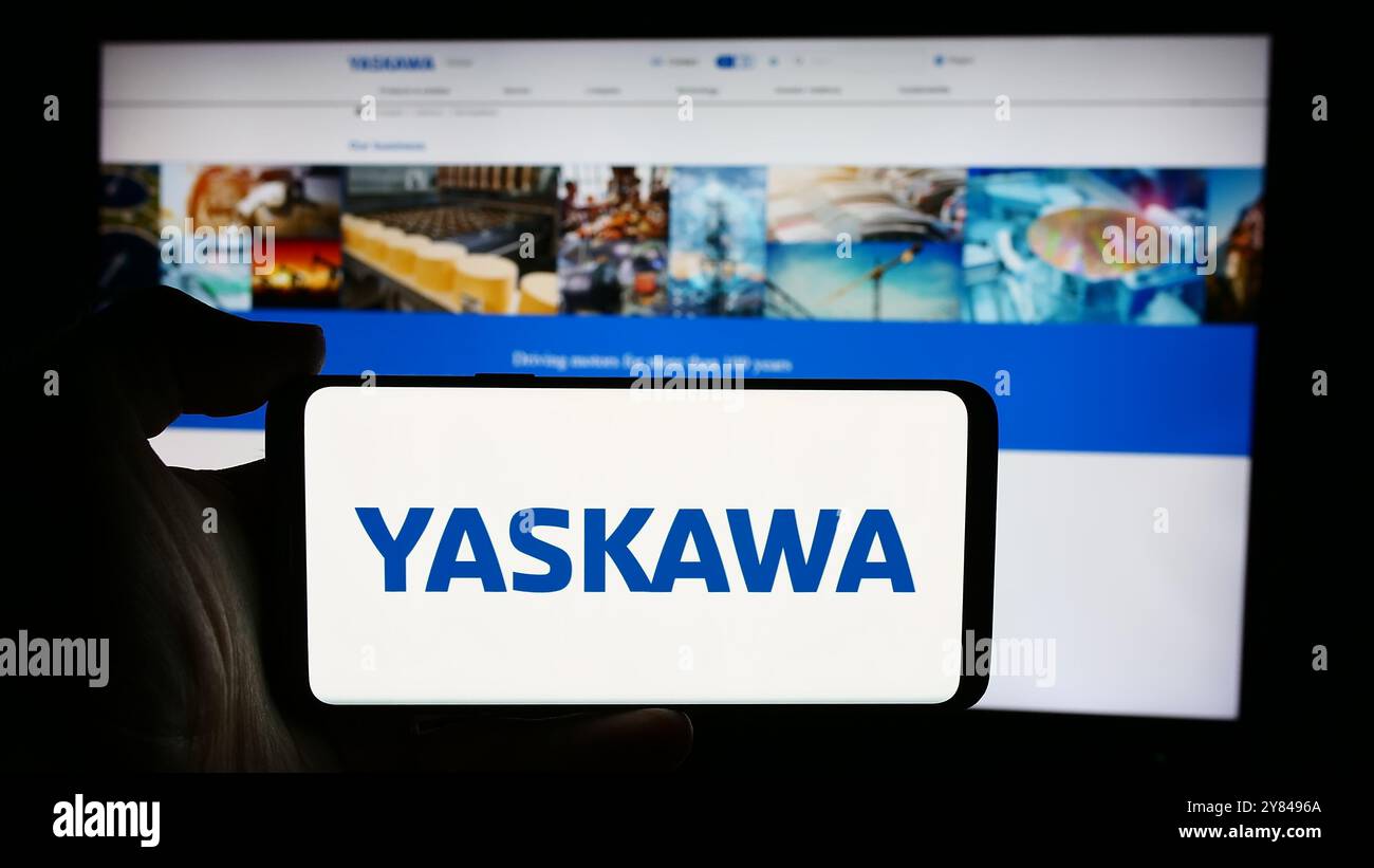 In this photo illustration, a person is holding a cellphone with the ...