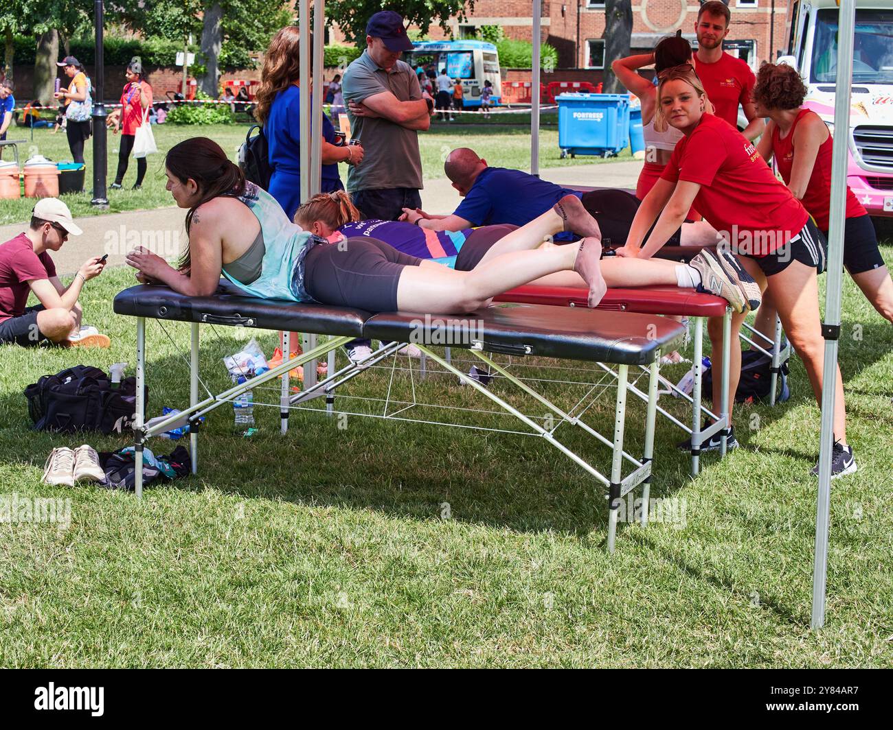 Half Marathon Runners Receiving Professional Massage Treatment After