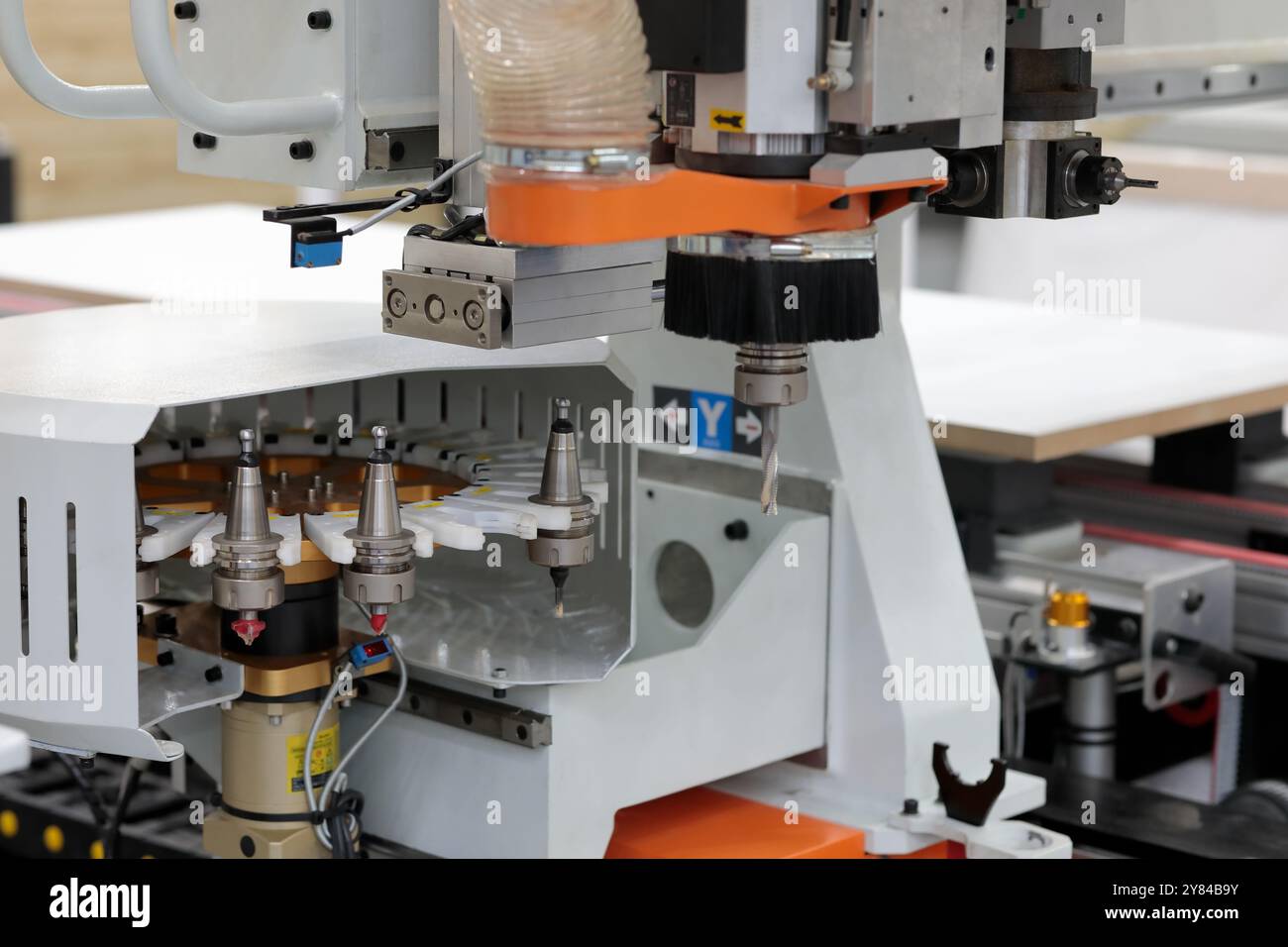 CNC router with automatic tool changer ATC and round tool magazine. Selective focus Stock Photo ...