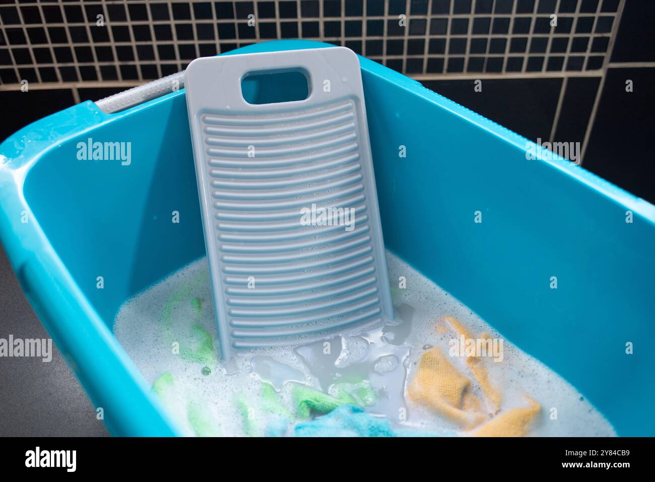 a gray washboard. traditional method of hand washing is effective for ...