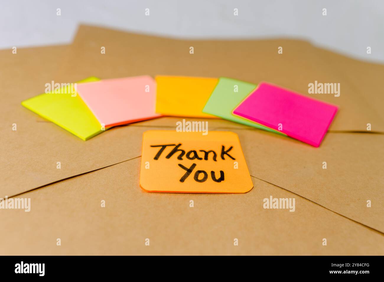 Thank you phrase written on recycled cardboard with a background of a ...