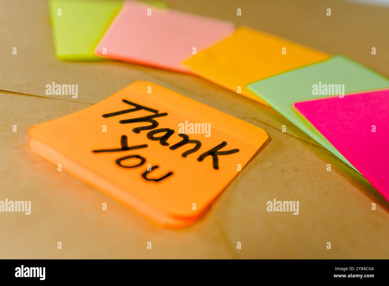 Thank you phrase written on recycled cardboard with a background of a ...