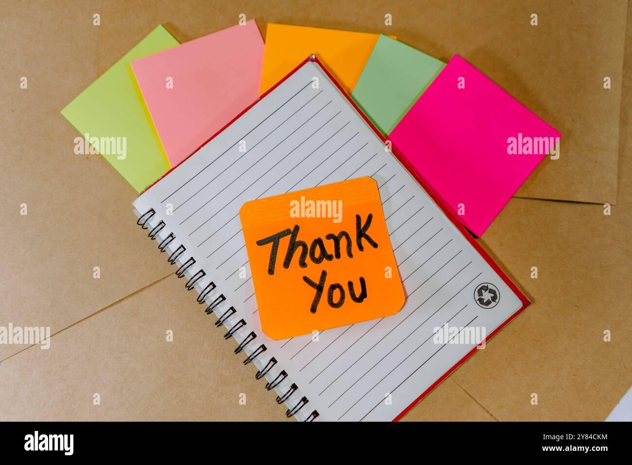 Thank you phrase written on recycled cardboard with a background of a ...