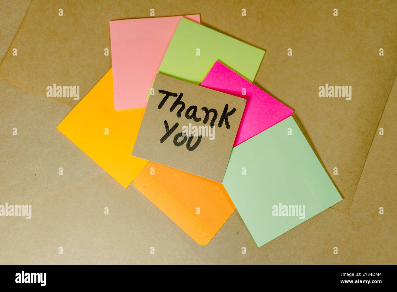Thank you phrase written on recycled cardboard with a background of a ...