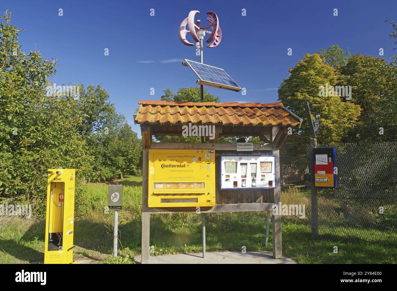 Small information stand with vending machines and solar cell in the ...