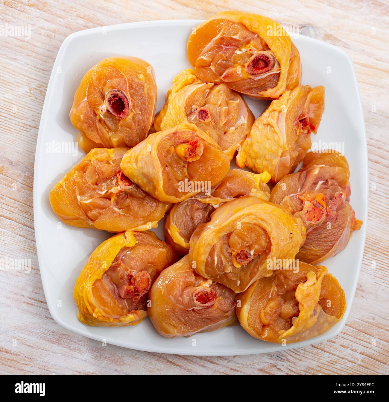 Uncooked sliced transversely chicken legs Stock Photo - Alamy