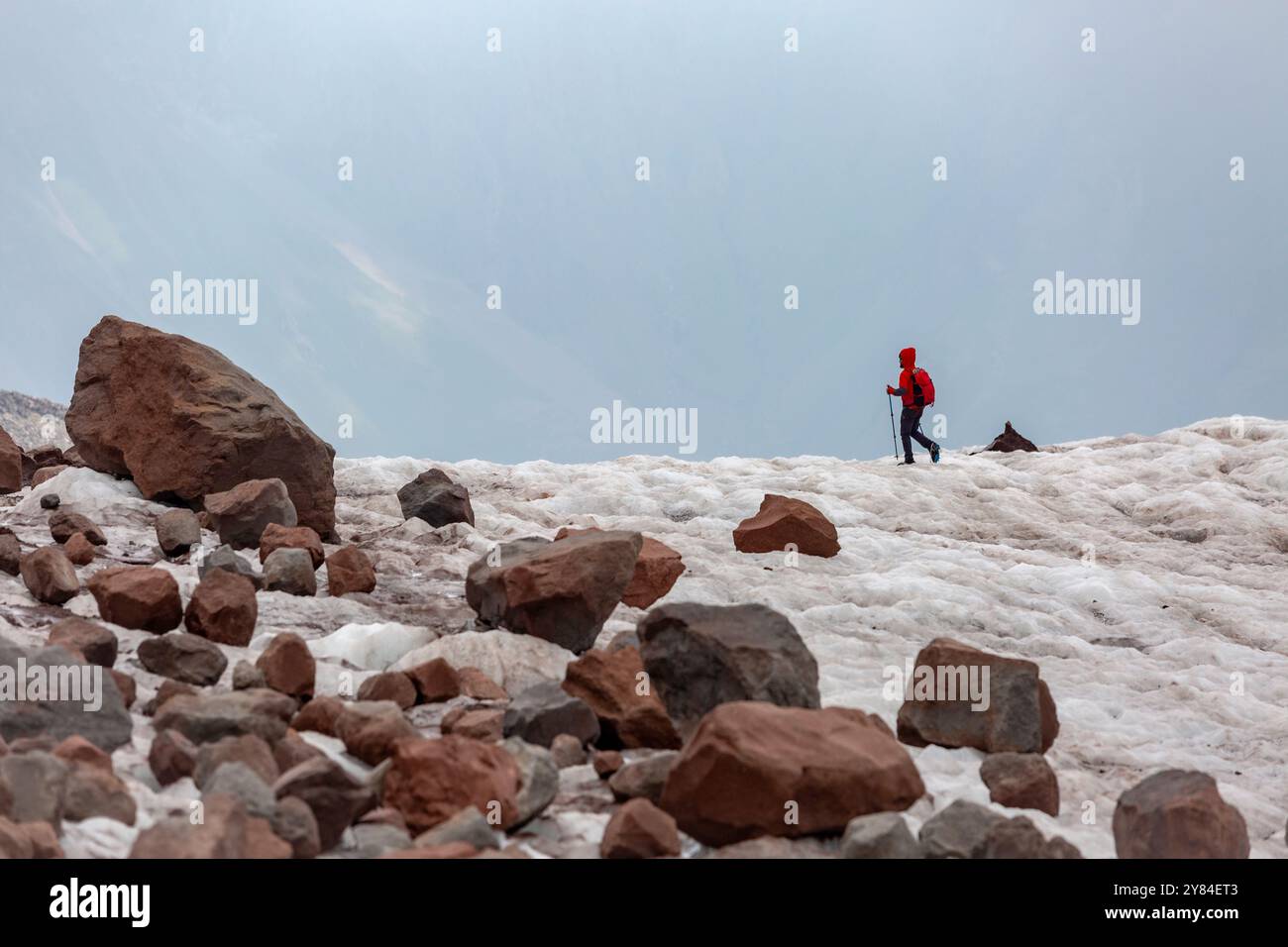 Climbers navigate the steep icy path on Kazbek, where layers of rock ...