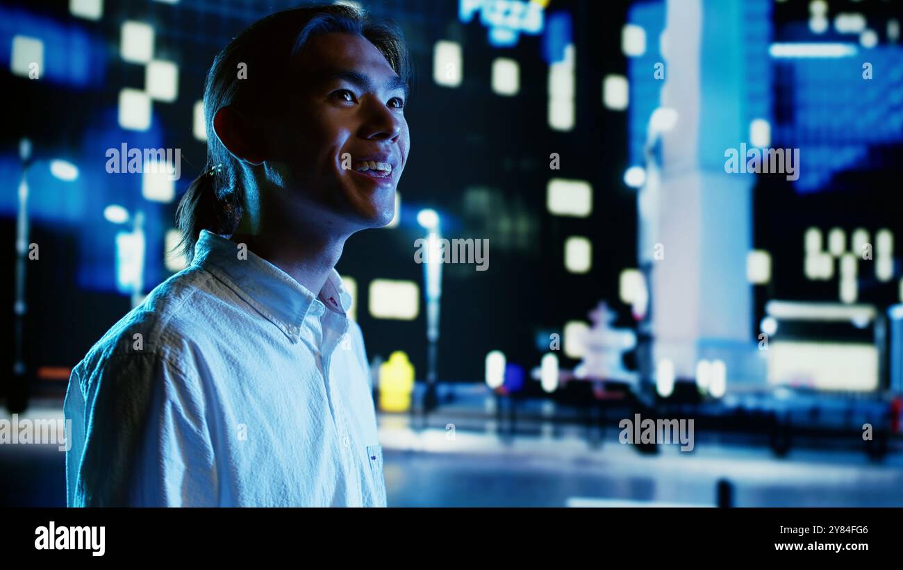 Asian man wandering around city avenues during nighttime, looking ...