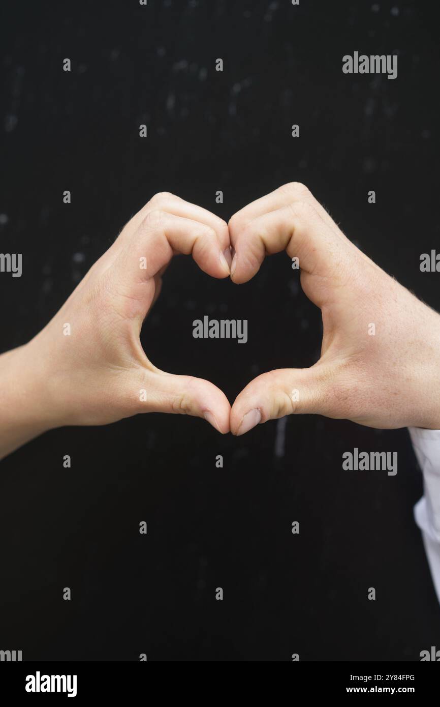 Two hands form a heart Stock Photo - Alamy
