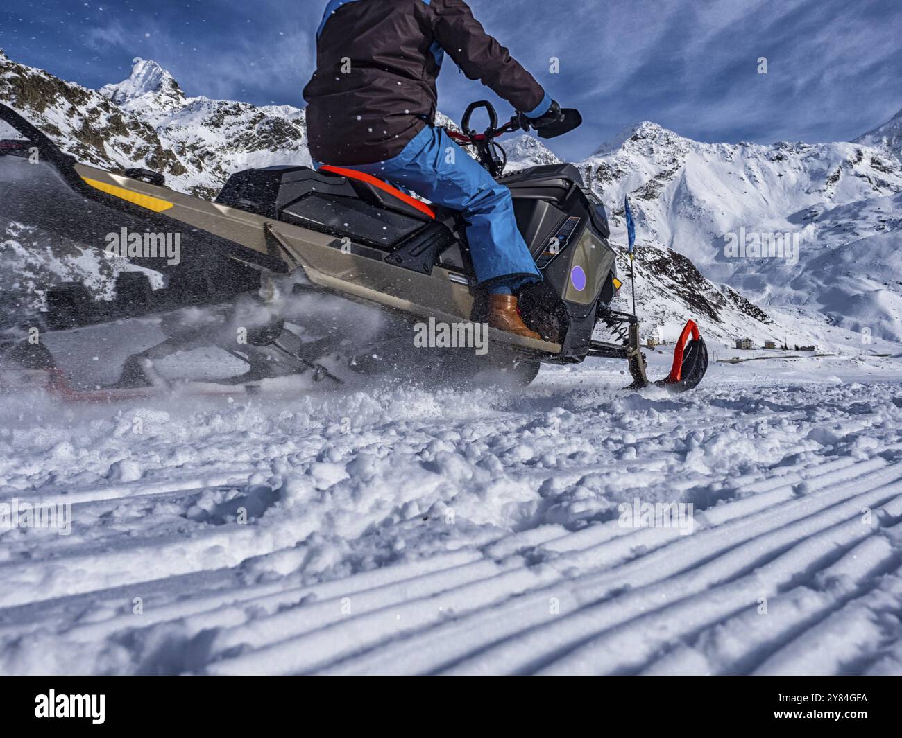 Snowmobile on a trail in the Italian alps Stock Photo - Alamy