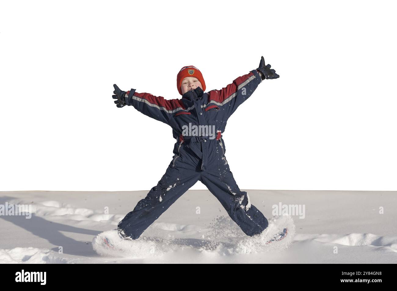 Boy forming a x shape with his body in snow Stock Photo - Alamy