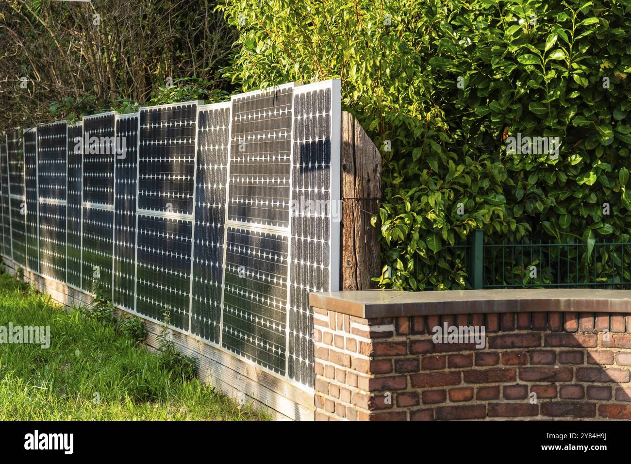 Solar fence, solar panels as a garden fence and privacy screen on a ...