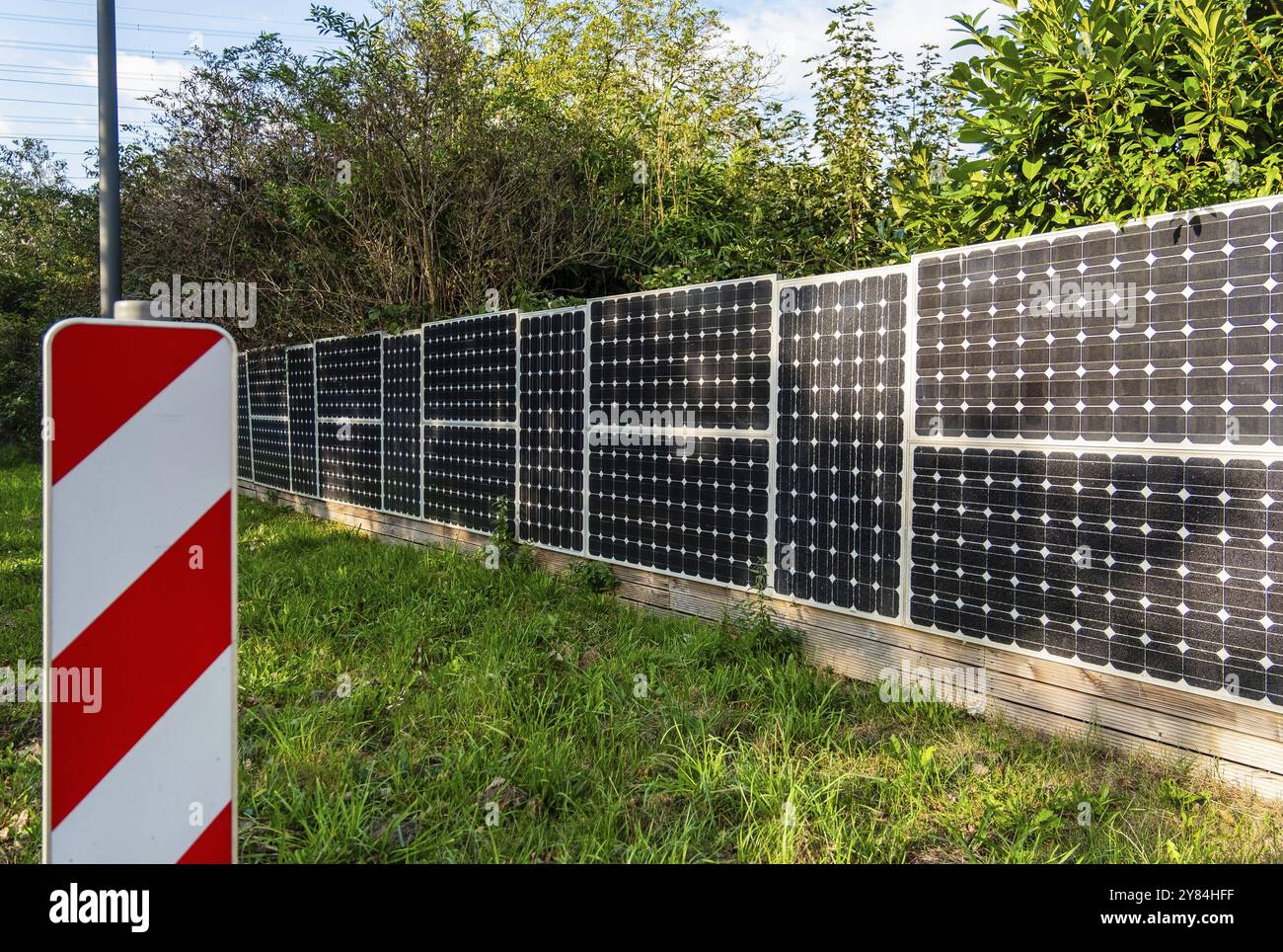 Solar fence, solar panels as a garden fence and privacy screen on a ...