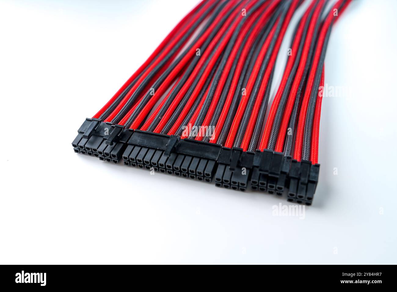 A black and red computer cable is isolated on a white background ...