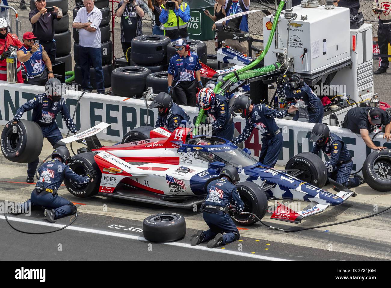 INDYCAR driver, SANTINO FERRUCCI (14) of Woodbury, Connecticut, brings ...