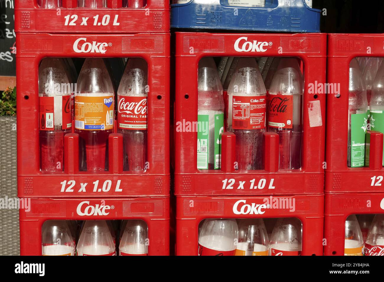 Empty plastic deposit bottles of the Coca Cola brand in a drinks crate ...