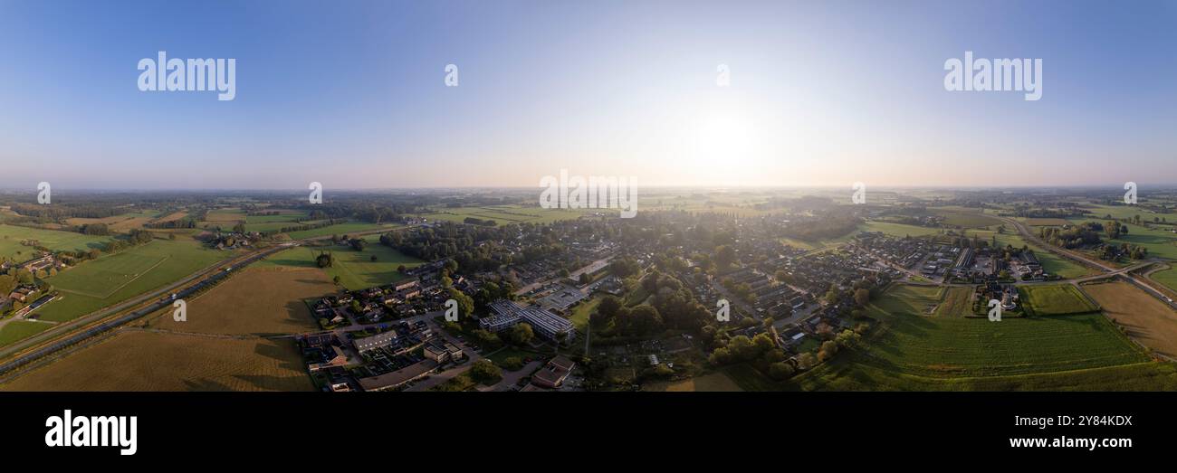 Sunrise wide aerial panorama of Dutch town Voorst in agrarian flat ...