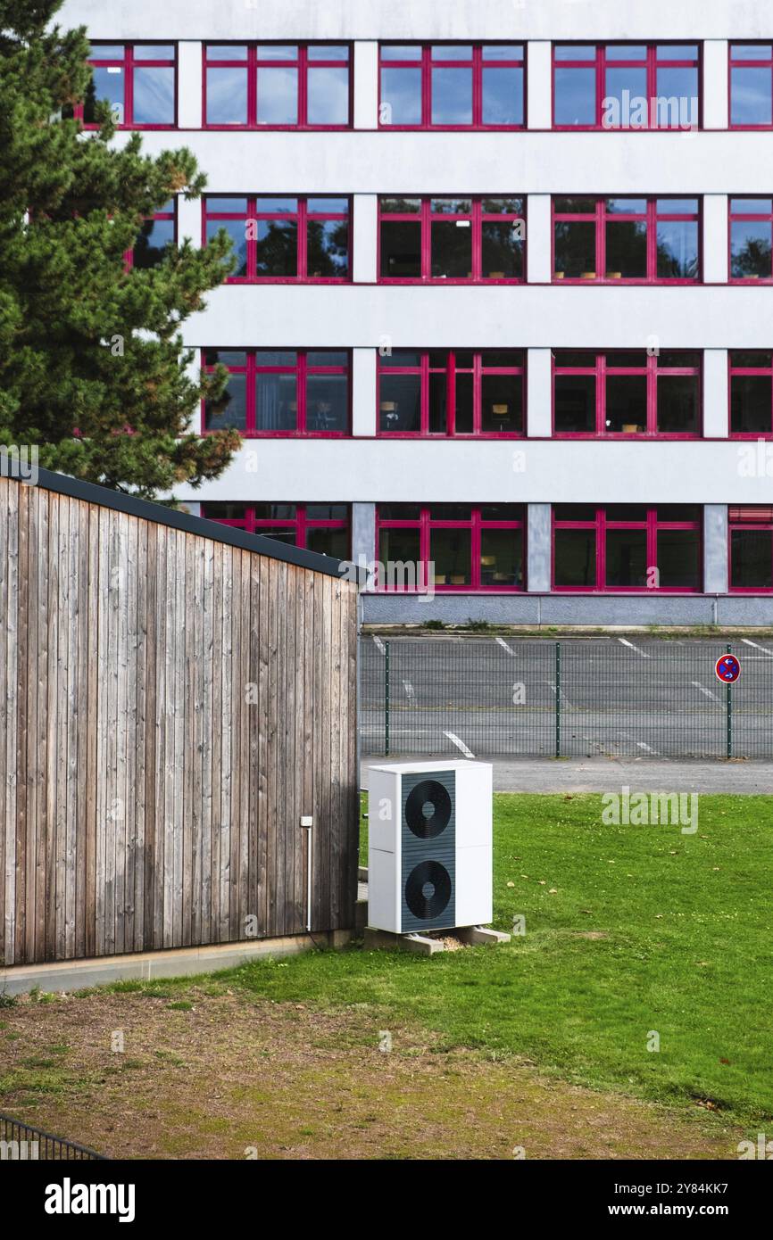 Two stacked heat pumps on a lawn in front of a house, Germany, Europe ...