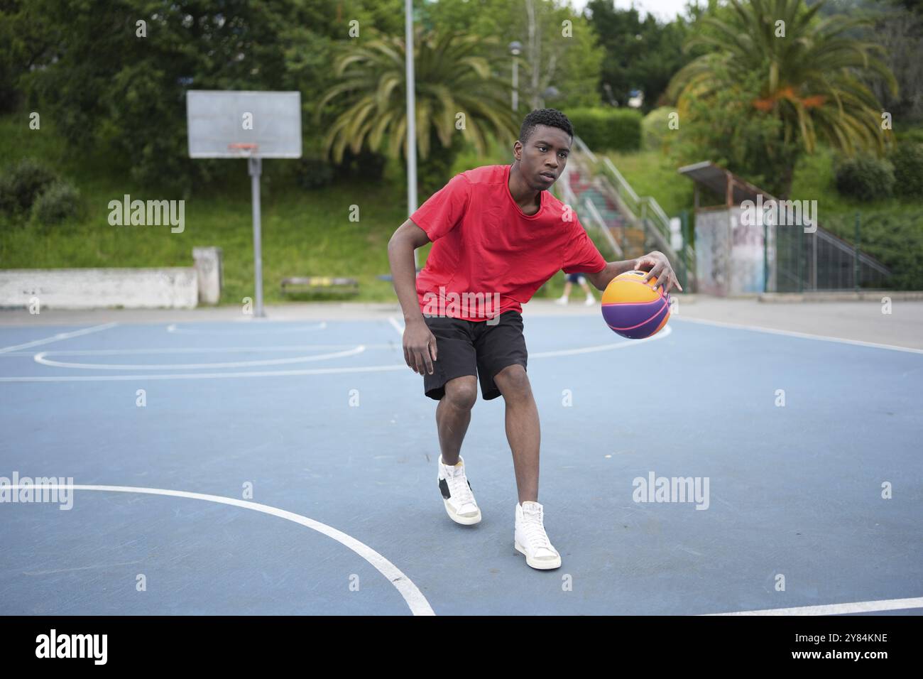 Basketball player practicing in park hi-res stock photography and ...