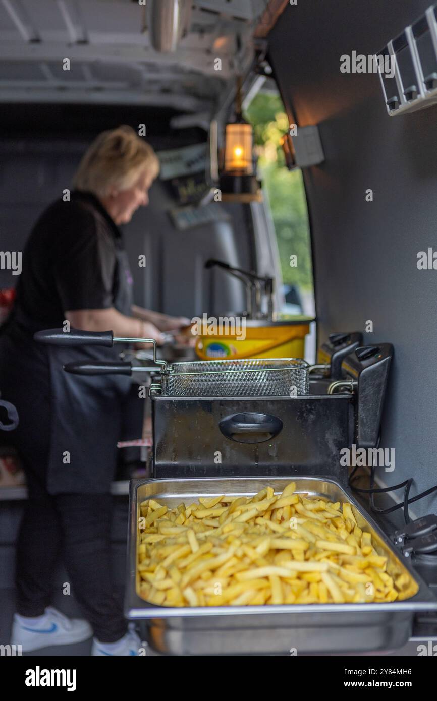 Mobile food truck fast food French fries and burger on location Stock ...